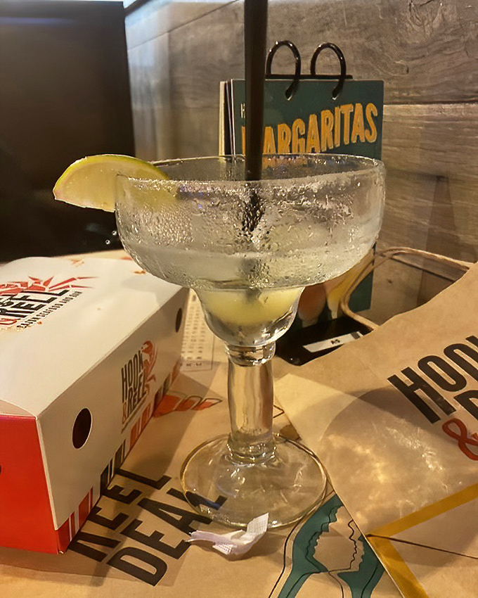 A margarita standing at attention, ready to cool the heat from your Cajun seafood adventure. Refreshment never looked so inviting. 