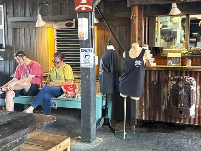 Nothing says "I survived the Junkyard experience" like branded merch. That tank top is both a souvenir and a warning to your future self. 