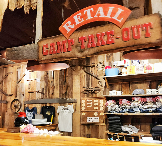 The "Camp Take-Out" sign promises you can take the flavors home, but good luck recreating that mountain magic.