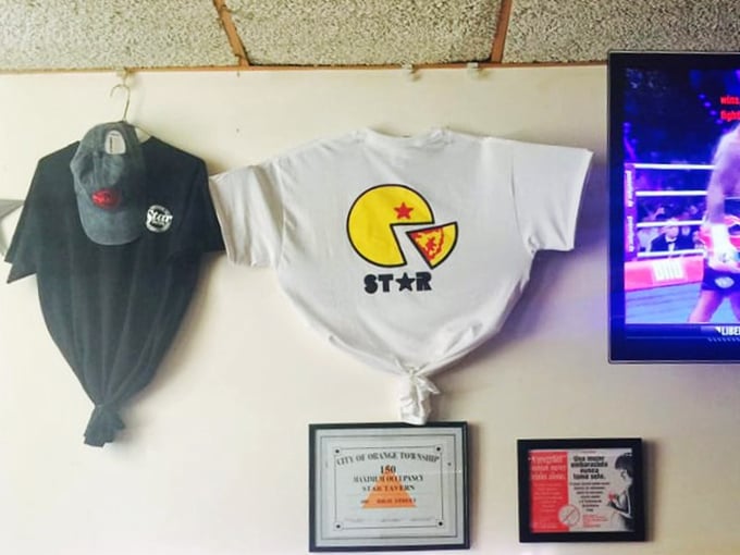The merch wall tells the story &ndash; when your pizza inspires t-shirt sales, you've transcended from restaurant to cultural institution.