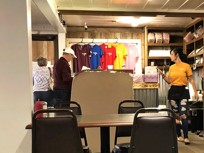 A glimpse of the merchandise corner reveals that Rose Garden isn't just a restaurant; it's a community identity worth wearing.