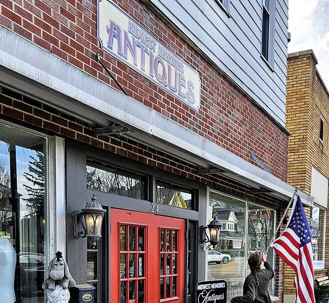 Midwest Memories Antiques beckons with its cheery red door, promising treasures that will have you saying, "My grandmother had one just like this!"