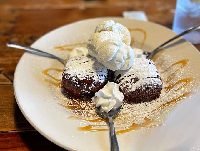 Mile High Beignets that live up to their name &ndash; pillowy perfection topped with ice cream that melts into every warm, chocolatey crevice.