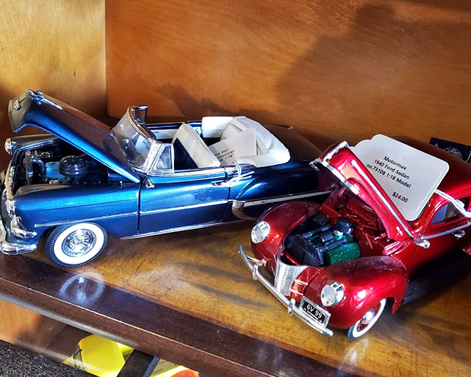 These model cars with their hoods up reveal tiny engines with impressive detail&mdash;automotive history in miniature for the discerning collector.