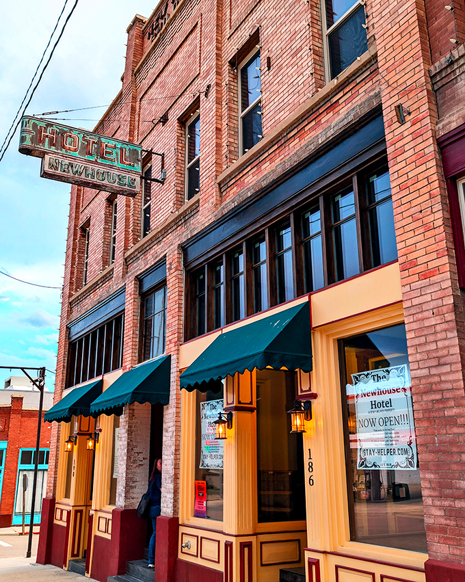 The Newhouse Hotel's vintage sign and awnings whisper tales of railroad workers, miners, and travelers who've passed through Helper's welcoming doors for generations.