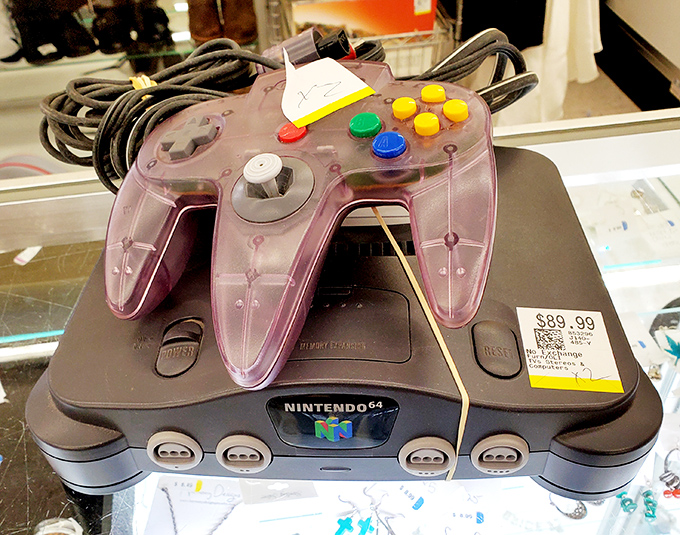 A Nintendo 64 that probably witnessed more Mario Kart battles than the actual Italian Grand Prix.