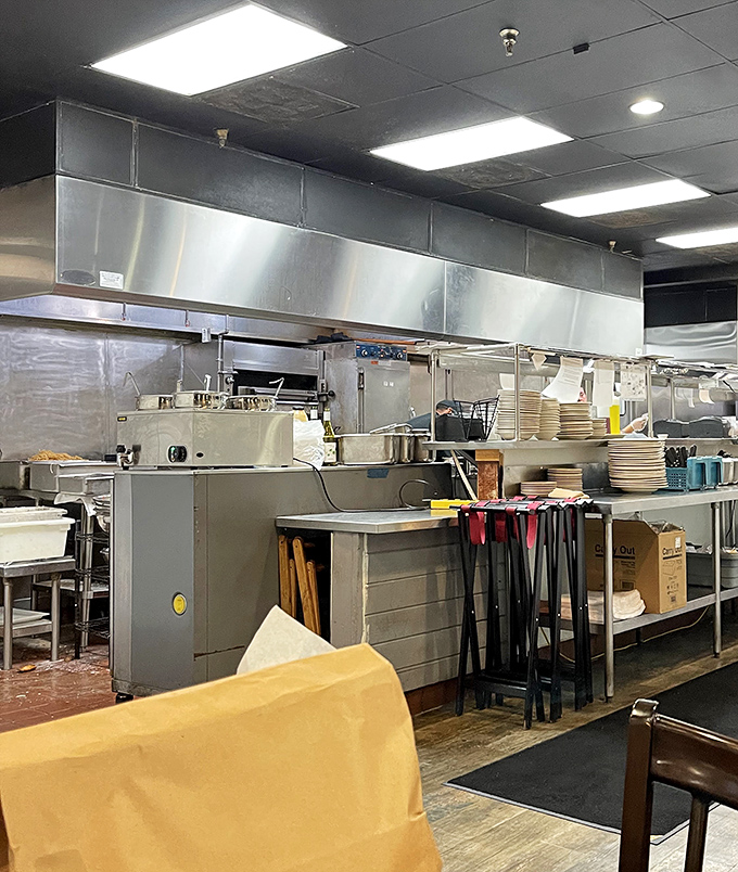 The kitchen: where smoke meets meat in a dance as old as time, orchestrated by folks who understand that patience is the secret ingredient.