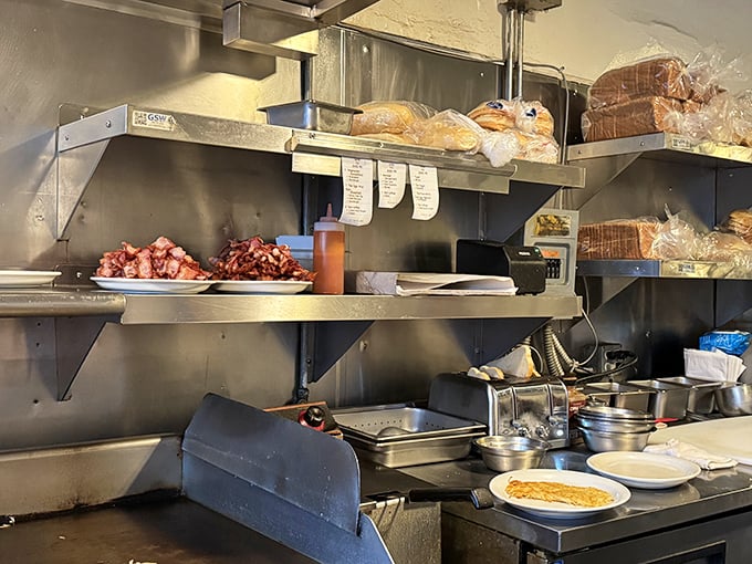 The kitchen ballet in full swing. Where hash browns are born and breakfast dreams are fulfilled with methodical, no-nonsense precision.