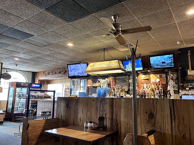 Another view of the bar's warm wood tones and multiple TVs &ndash; the Switzerland of sports bars where rival fans peacefully coexist.