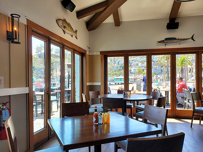 Floor-to-ceiling windows frame Avalon's picturesque harbor, turning an ordinary lunch into a postcard-worthy memory you can taste.