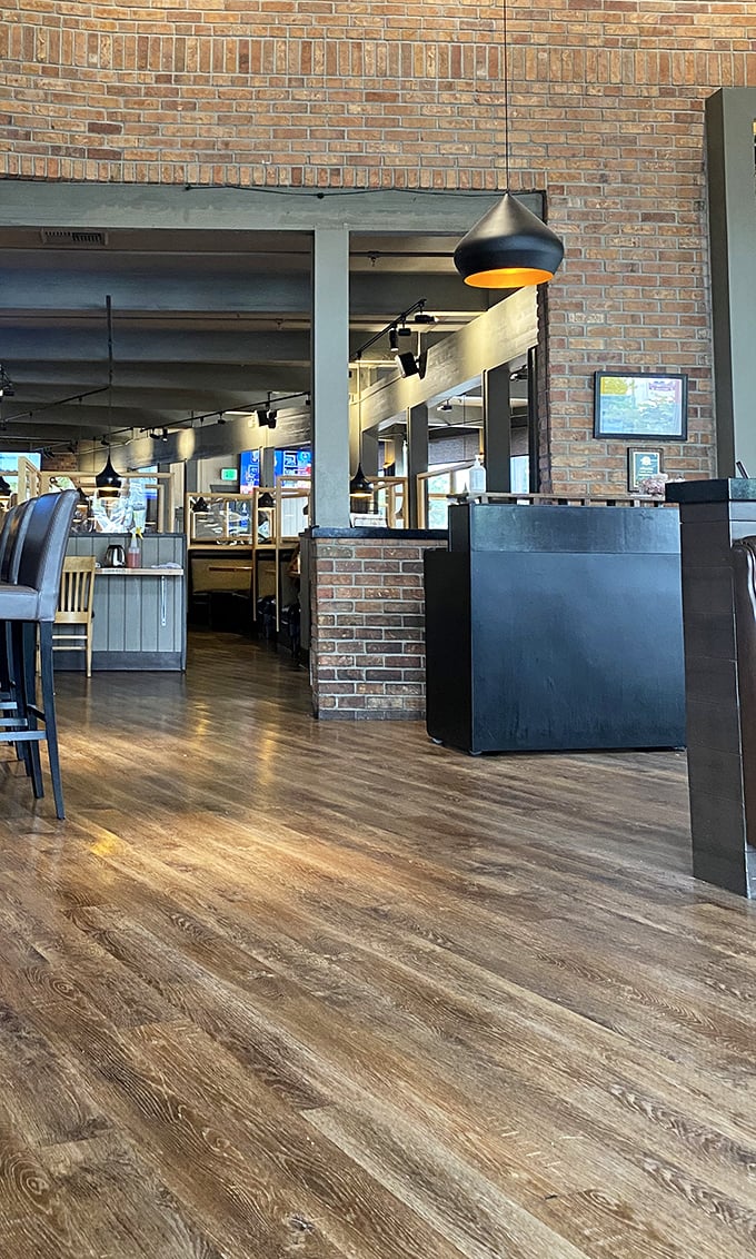 Exposed brick and industrial touches blend with warm lighting to create a space that feels both contemporary and timeless—like your favorite jeans.