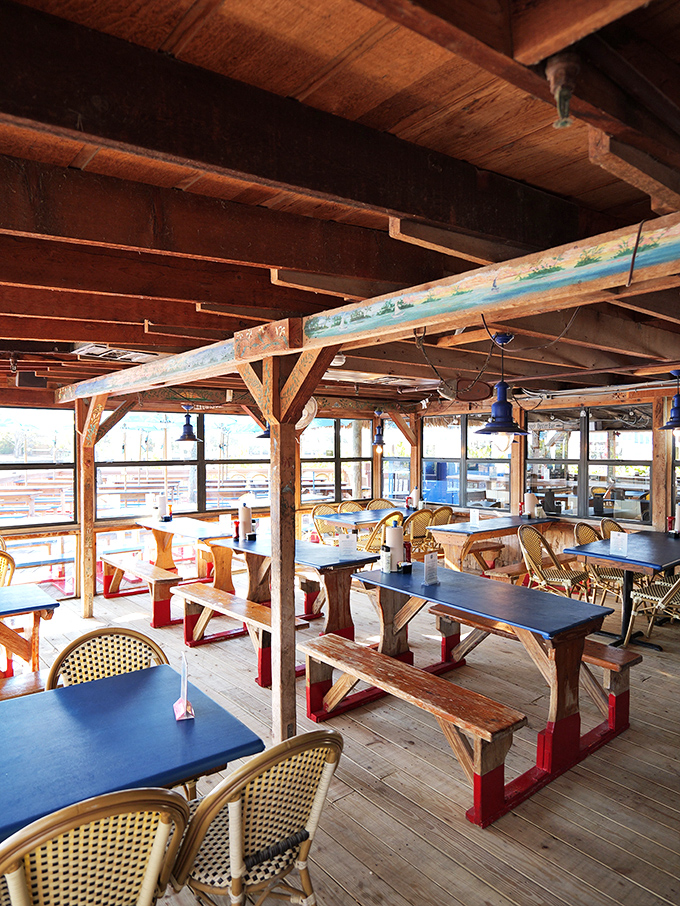 Weathered wood, natural light, and blue tables &ndash; the restaurant equivalent of your favorite broken-in boat shoes. Comfortable perfection.