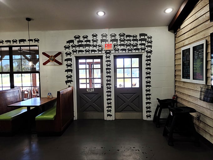 The pig silhouettes framing the exit door serve as a playful reminder of the smokehouse skills that complement Charm City's seafood prowess.