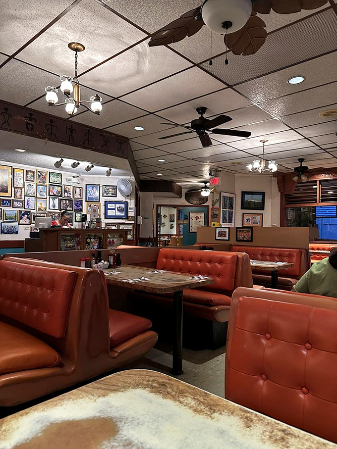 Every booth tells a story, every table holds a memory. The walls showcase decades of Hilo history between bites.