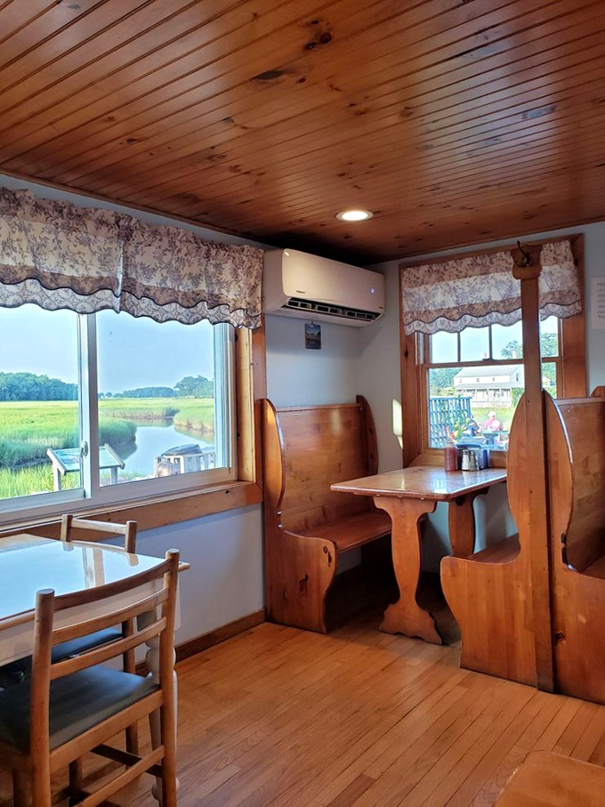 Church-pew style seating and panoramic marsh views create a dining sanctuary. Seafood with a side of serenity.