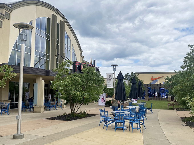 Al fresco dining meets retail therapy. These blue chairs invite you to rest weary shopping legs while plotting your next store conquest.