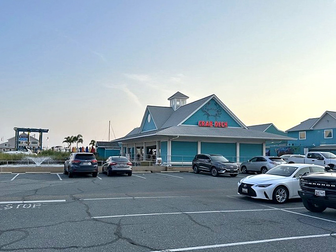 As the sun sets, the turquoise landmark takes on a golden glow, standing as a beacon for hungry travelers seeking crustacean salvation.