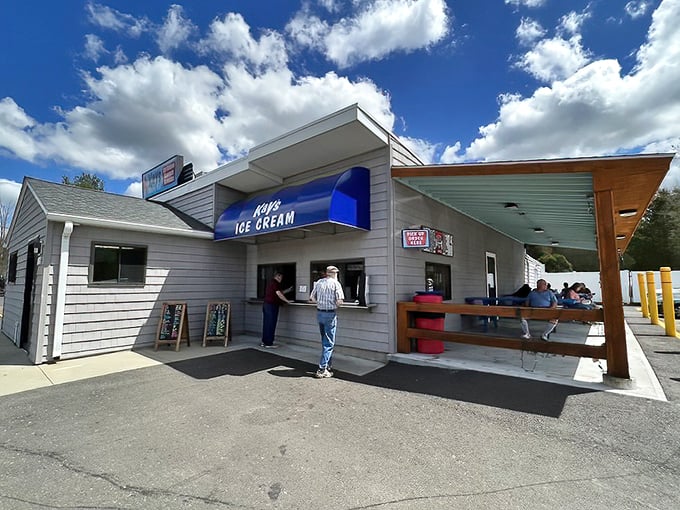 The ice cream window at Kay's &ndash; where summer dreams are served one scoop at a time under the watchful gaze of Massachusetts skies.