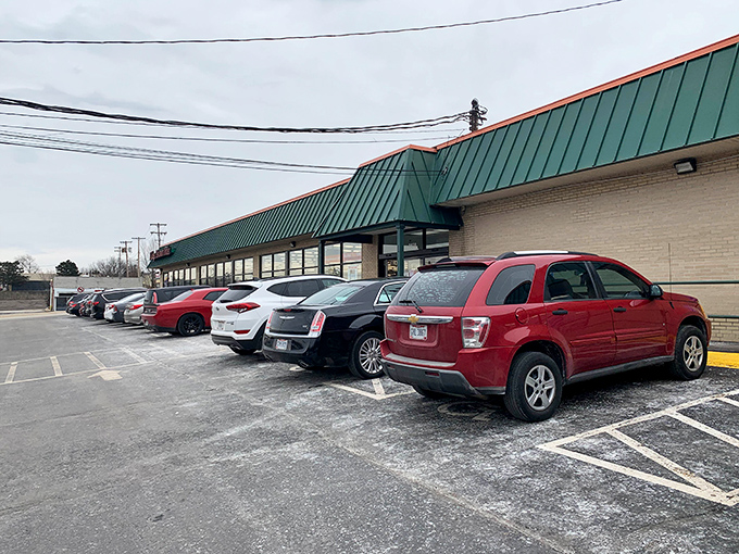 Winter's chill doesn't deter the dedicated bargain seekers. Village Discount's parking lot fills regardless of season—thrifting waits for no weather.