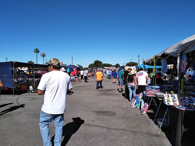 The market's main drag buzzes with weekend warriors on the hunt. Every aisle promises the possibility of that perfect unexpected find.