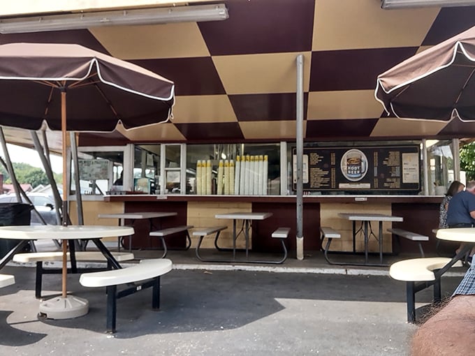 The outdoor seating area—where strangers become temporary friends united by the universal language of "mmm" and "pass the napkins."