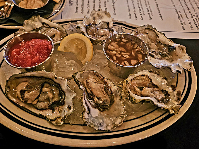 Oysters arranged like jewels on ice, with cocktail sauce standing by. The ocean meets Kentucky in this plate of briny perfection.