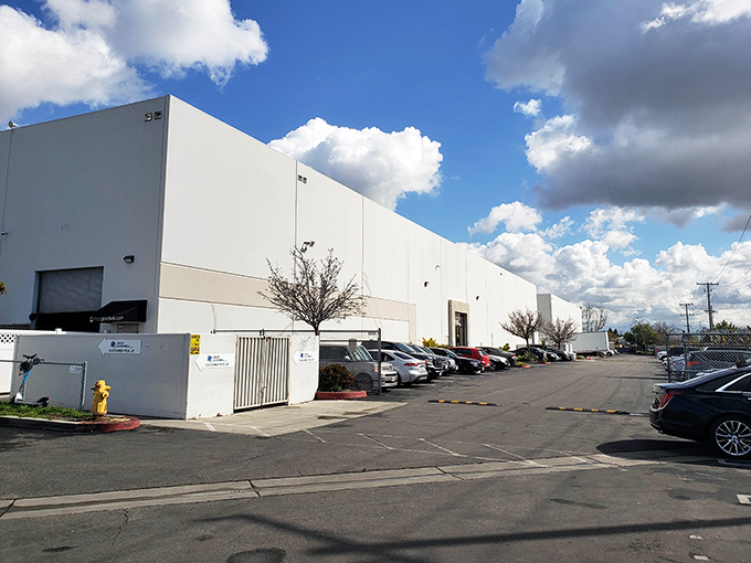 The industrial-scale operation behind your bargain finds. This warehouse processes mountains of donations before the best items reach the sales floor.