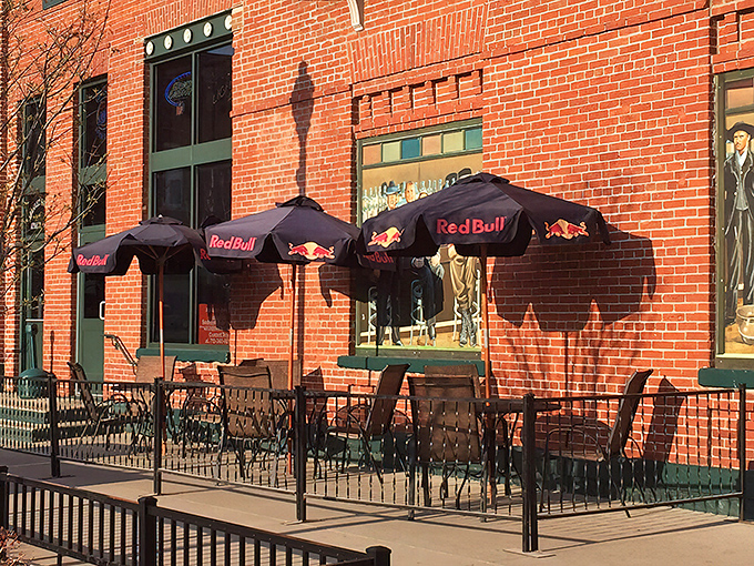 The patio scene offers prime people-watching real estate under Red Bull umbrellas, where summer afternoons stretch lazily into evening like a cat in sunshine.