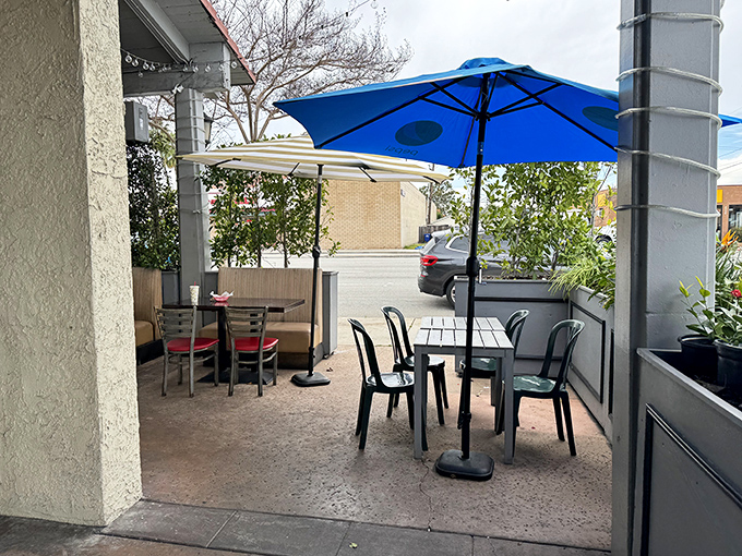 The patio offers al fresco dining under blue umbrellas, because fish tacos somehow taste even better with a side of sunshine.