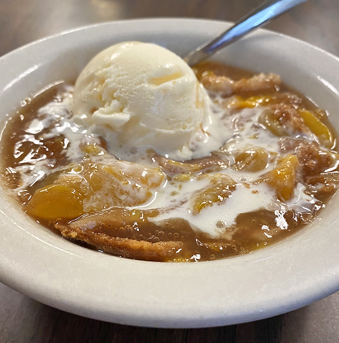 Peach cobbler topped with melting vanilla ice cream&mdash;where warm fruit meets cold cream in a dessert romance that's been making Texans swoon for generations.