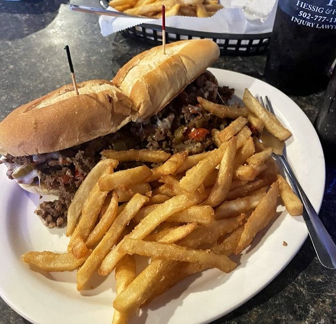 That Philly cheesesteak is so loaded it's practically defying the laws of sandwich physics with every delicious bite piled high.
