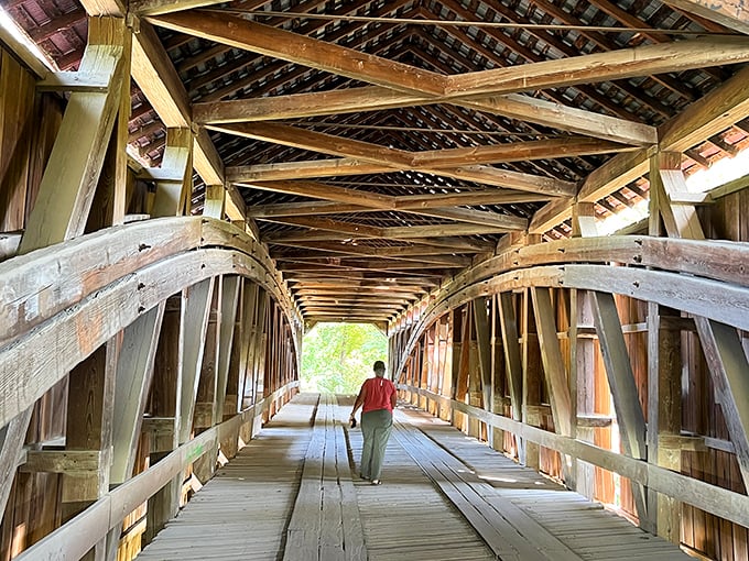 The perfect tunnel for contemplative walks, where sunlight creates dappled patterns on planks worn smooth by time. History beneath your feet.