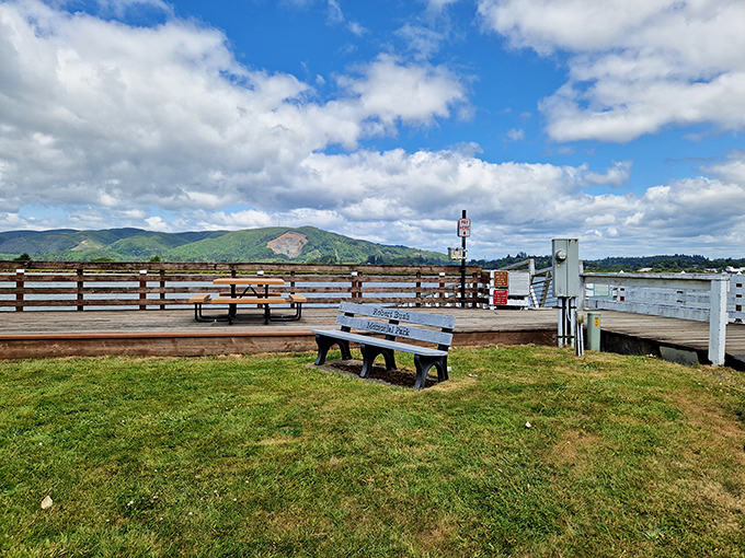 Benches dot the waterfront area, inviting visitors to sit, relax, and contemplate life beside a giant oyster.