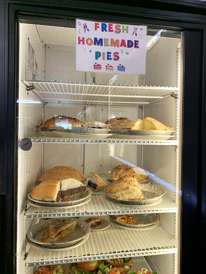 The pie case - where willpower goes to die and "I'll just have a small slice" becomes the lie you tell yourself before ordering a whole pie to go.