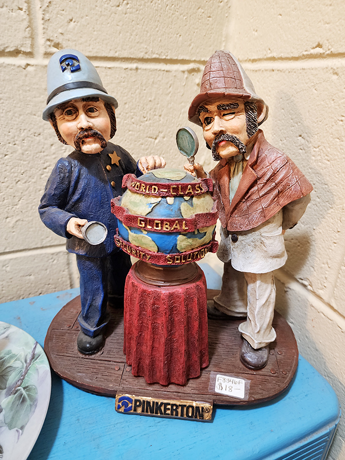 These Pinkerton detective figurines stand guard over a miniature globe, solving mysteries from another century with tiny magnifying glasses.