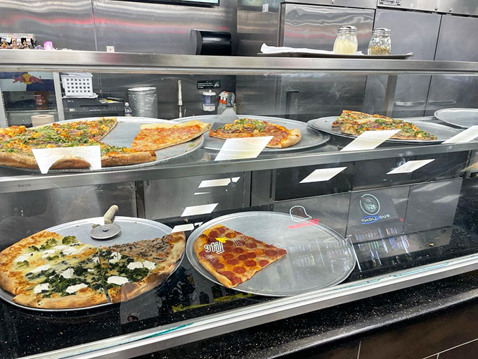 Pizza display cases &ndash; the art galleries of the food world. Each pie a masterpiece waiting to be appreciated slice by delicious slice.