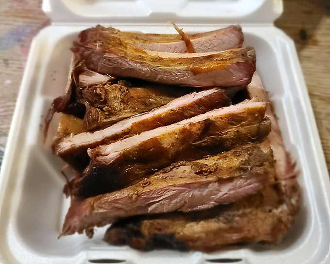 Sliced brisket with that telltale pink edge&mdash;proof that patience and proper smoking technique yield extraordinary results.