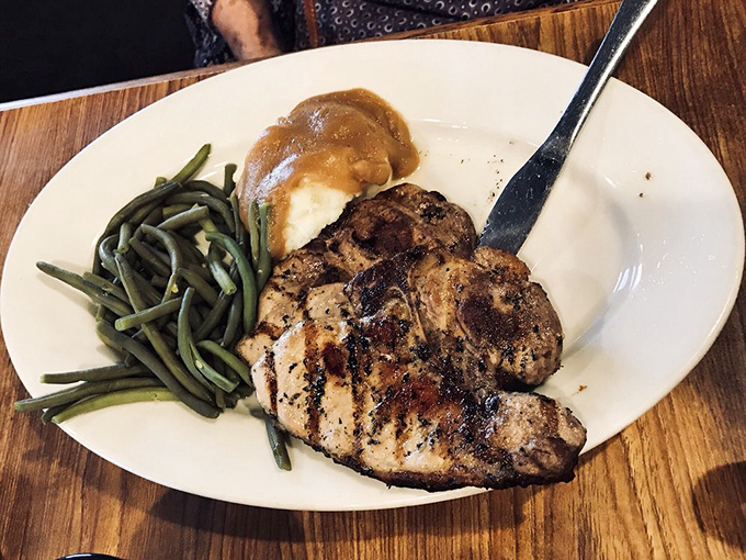 Perfectly grilled chicken breast with green beans and mashed potatoes&mdash;proof that Mickey's non-steak options deserve their own spotlight.