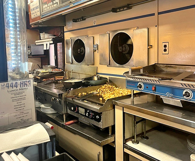 The beating heart of the diner&mdash;a compact kitchen where home fries sizzle on the flattop and breakfast dreams become reality.