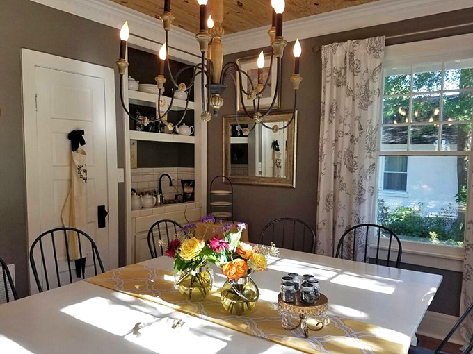 The private dining room feels like eating in a stylish friend's home—if your friend had impeccable taste and a chandelier that belongs in a design magazine.
