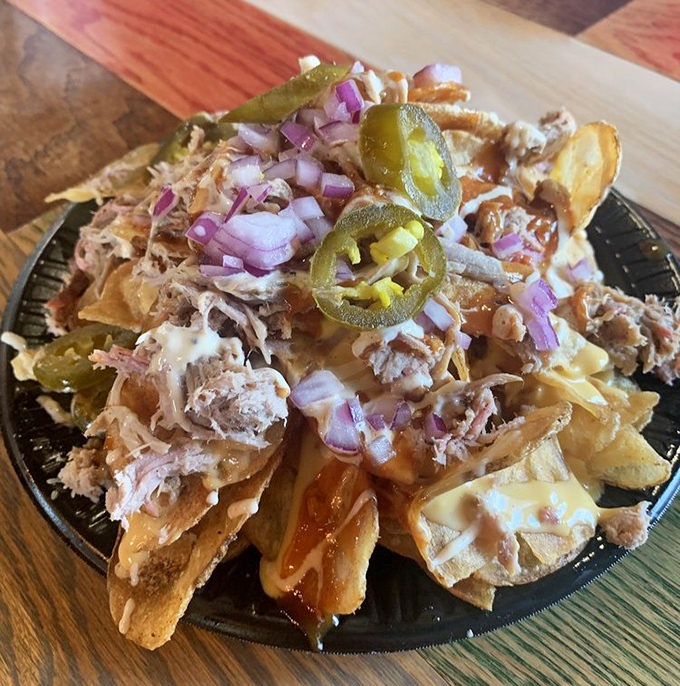 Nachos reimagined through a BBQ lens. When pulled pork, jalape&ntilde;os, and cheese come together like this, resistance is both futile and foolish. 