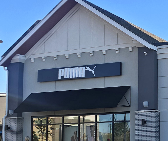 Puma's sleek storefront promises athletic wear that makes you look like you work out more than you actually do—the true American dream.