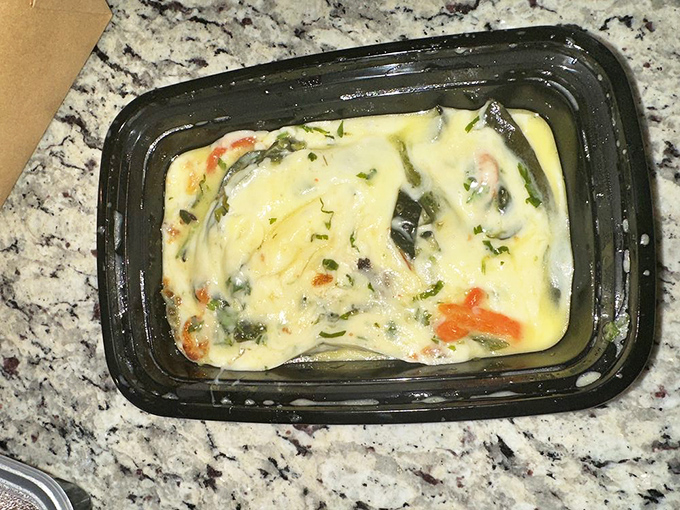 Queso fundido in its to-go glory&mdash;proof that even when you leave, the cheese refuses to let the relationship end.