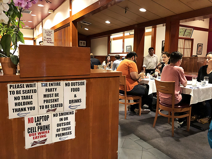 House rules posted without apology&mdash;no cell phones, no outside food&mdash;because some experiences deserve your complete, undivided attention.