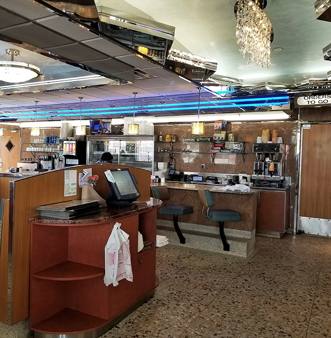 The heart of operations: where orders are called, coffee is poured, and the orchestrated chaos of diner service unfolds with surprising grace.