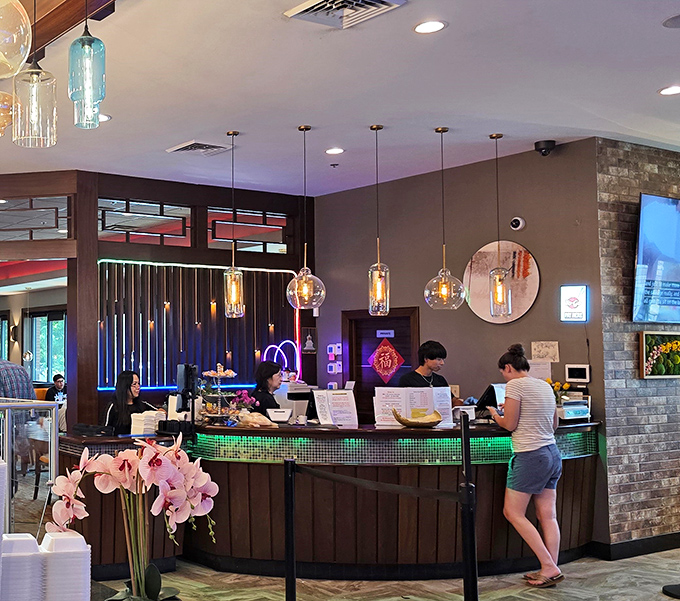 The reception desk glows with colorful mosaic tiles, like a dashboard that controls your journey through a world of flavors.