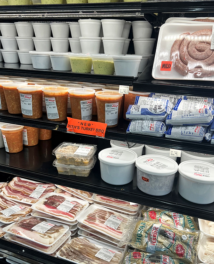 The refrigerated case offers take-home treasures including Smith's famous pimento cheese and BBQ &ndash; extending the experience beyond your visit.