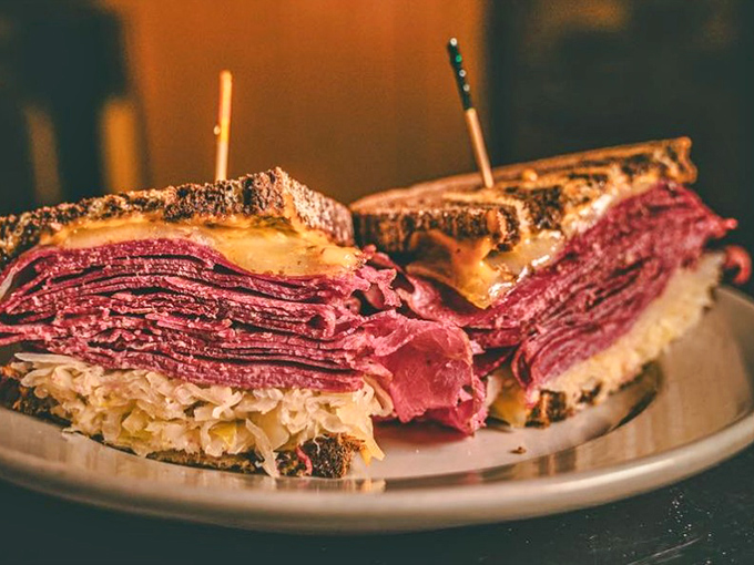 This isn't just a Reuben sandwich—it's a skyscraper of corned beef and sauerkraut that requires a game plan before the first bite.