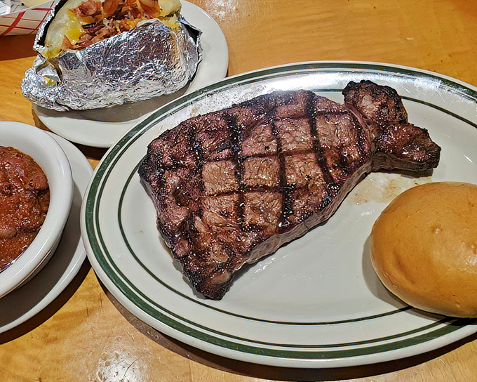 A ribeye steak with perfect grill marks that whispers, "Yes, they do more than burgers, and we do it spectacularly well."