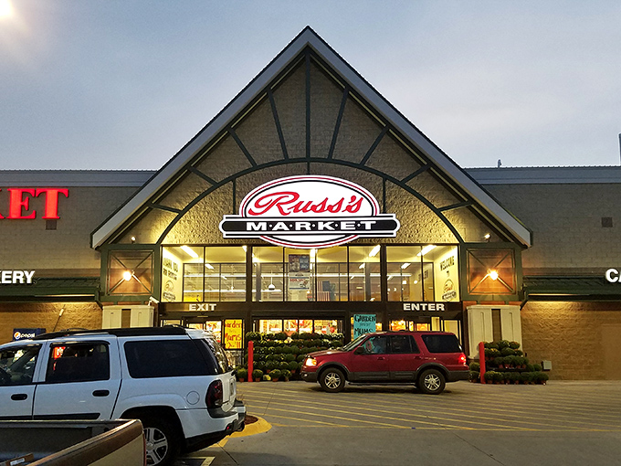 Russ's Market glows invitingly at dusk, a grocery store where the produce is fresh and the prices don't require a financial advisor's approval.